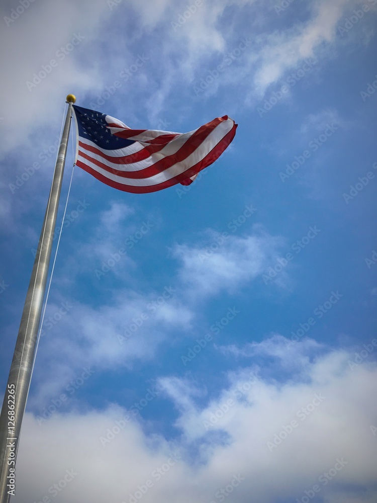 rhe American flag proudly flying Stock Photo | Adobe Stock
