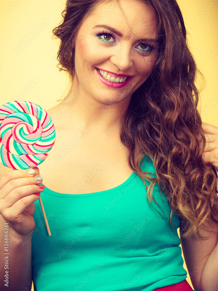 Woman charming girl with lollipop candy Stock Photo | Adobe Stock