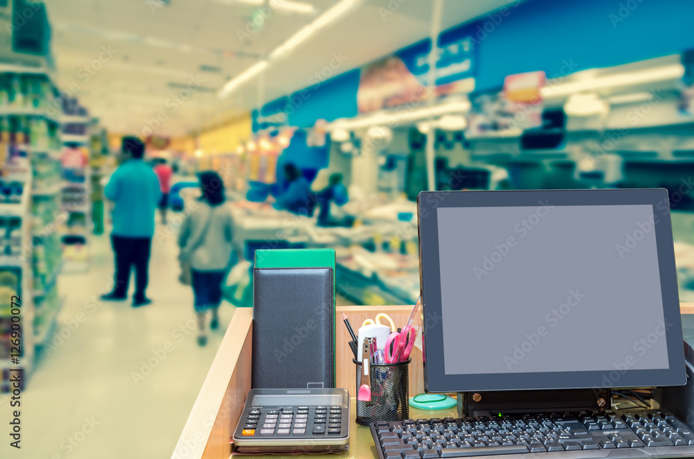 Poster Cashier operating at the cash desk over the Abstract blurred pho ...