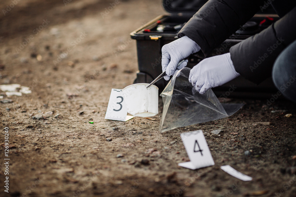 Crime scene investigation - collecting evidence . Stock Photo | Adobe Stock