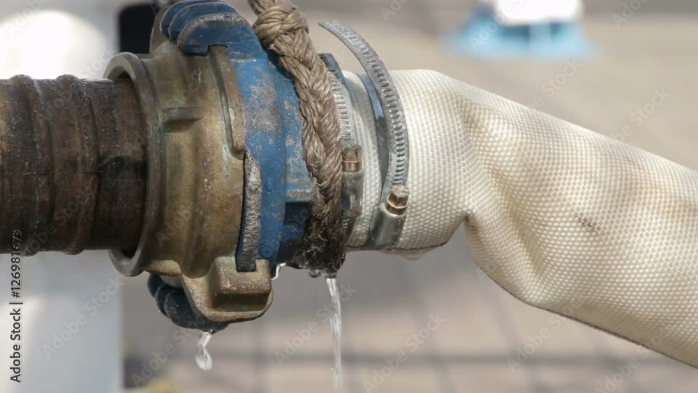 Video „Close, fire hydrant spraying water, connected to hose line ...