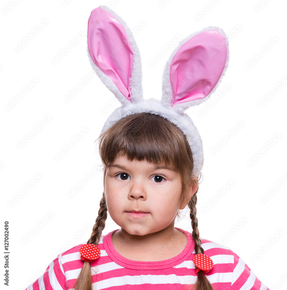 Happy little girl with pink rabbit ears. Portrait of cute caucasian ...