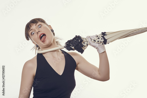 Terrified woman shouting while pulled aside and strangled by umbrella ...