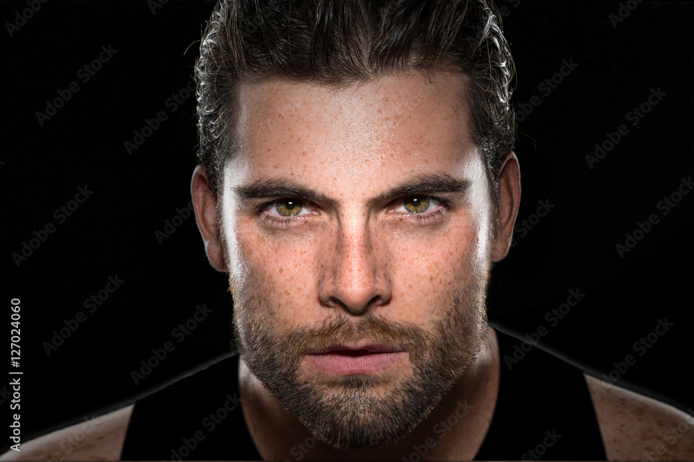 Handsome male athlete body builder with facial hair and intense eyes on ...