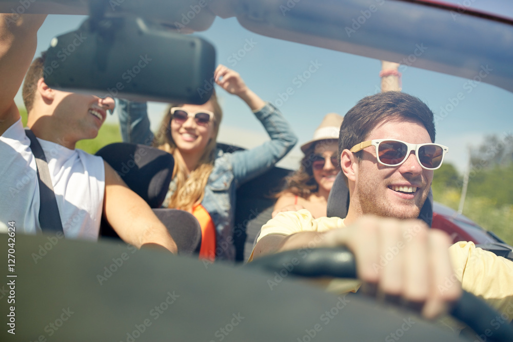 happy friends driving in cabriolet car Stock Photo | Adobe Stock