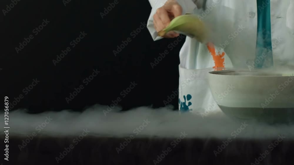 Frozen in liquid nitrogen. A hammer smashing banana frozen in liquid ...
