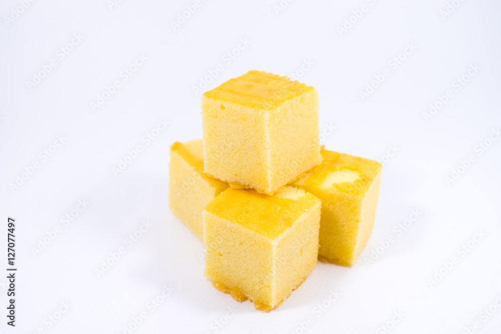 square butter cake on white background. square butter cake stack ...