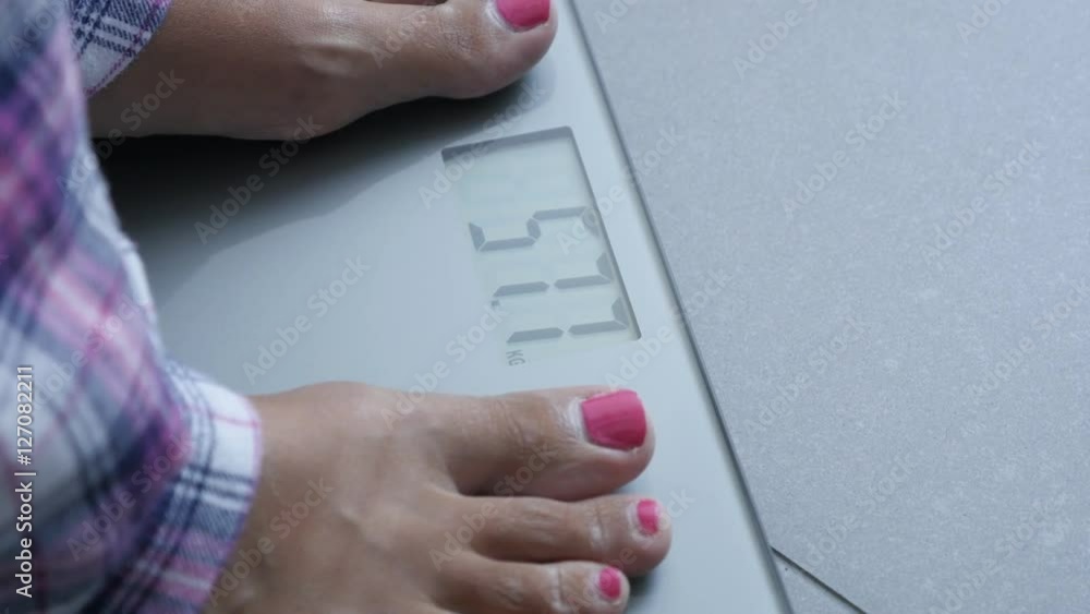 Silver digital health scale using in bathroom atmosphere 4K 2160p 30fps ...