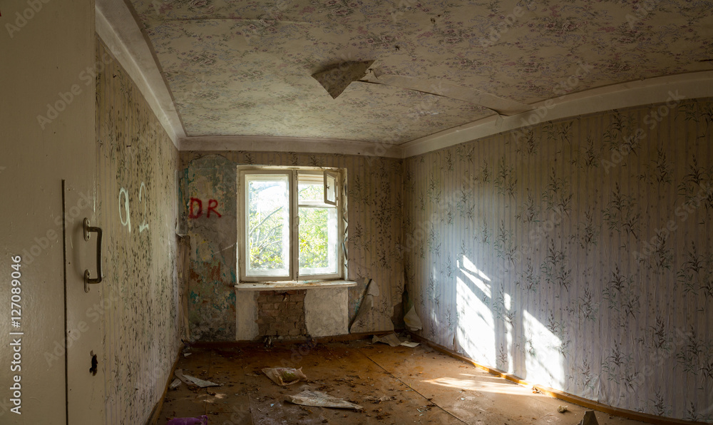 Abandoned destroyed house destroyed interior, stripped the walls of the ...