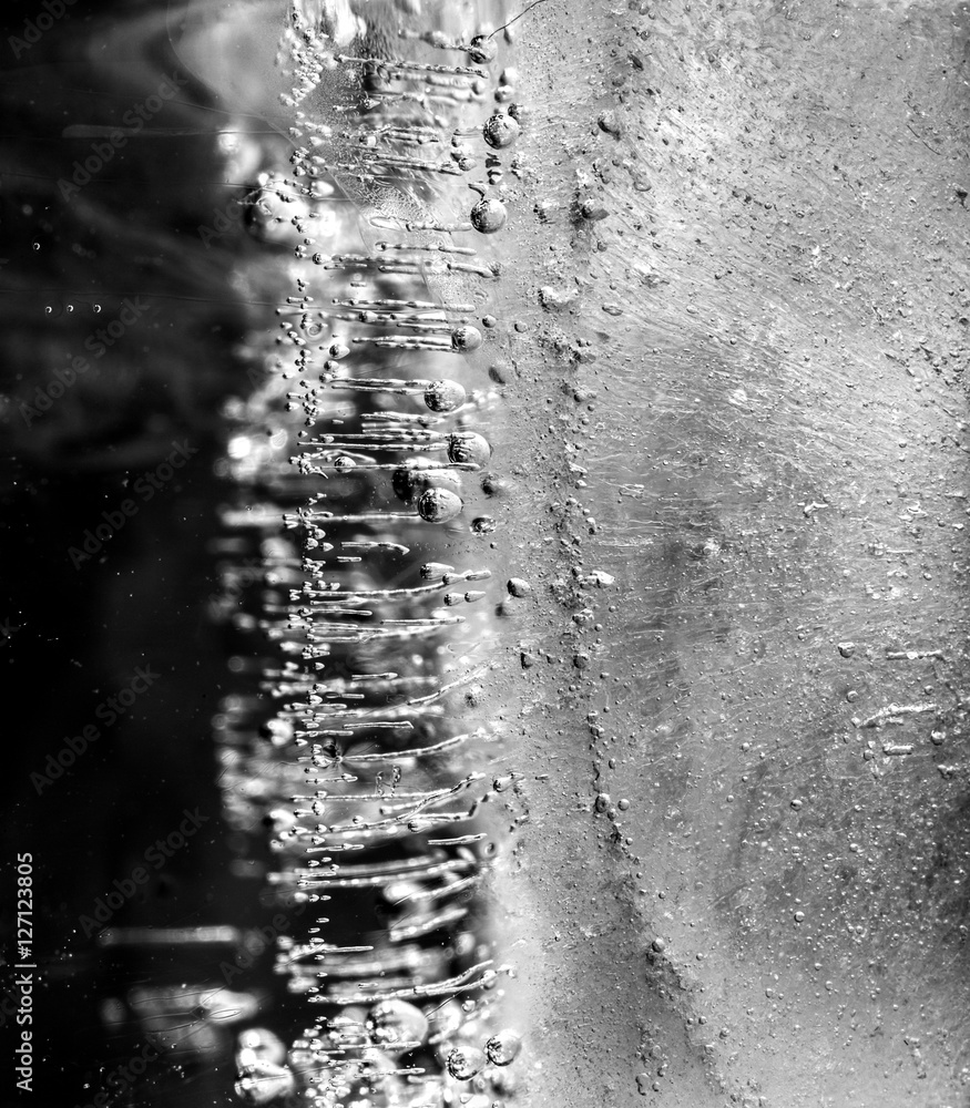 Micro air bubbles in the ice frozen during their movement to the water ...