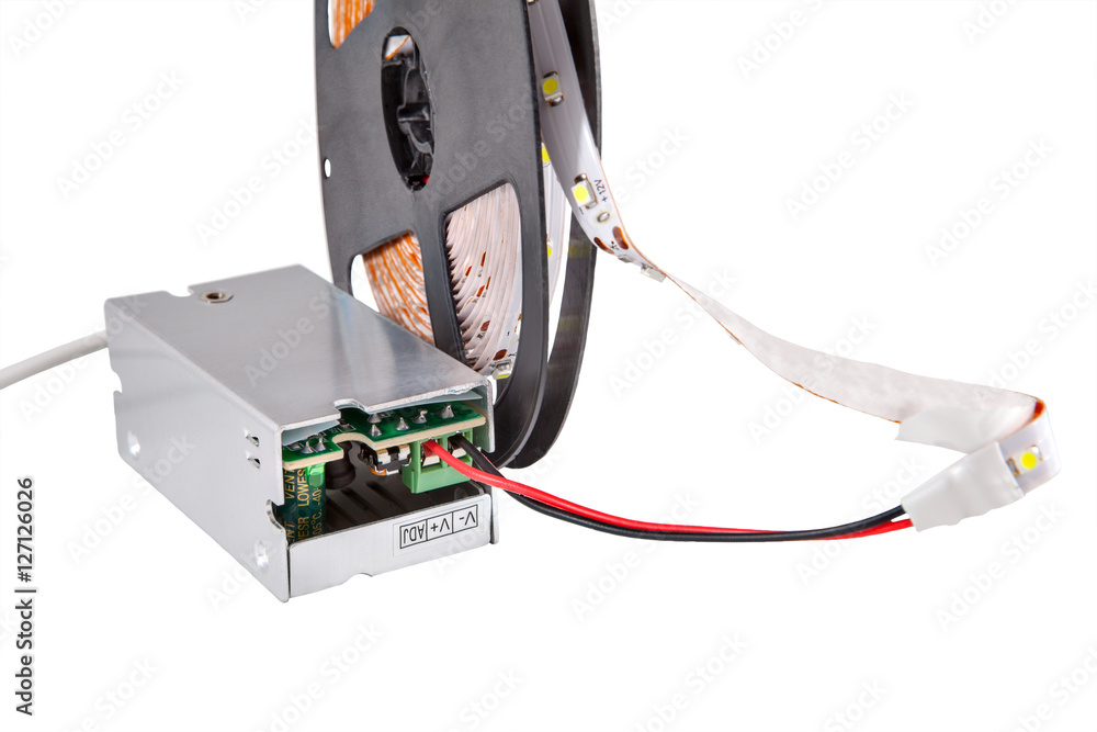 LED strip on plastic coil, connected to a voltage converter. Stock ...
