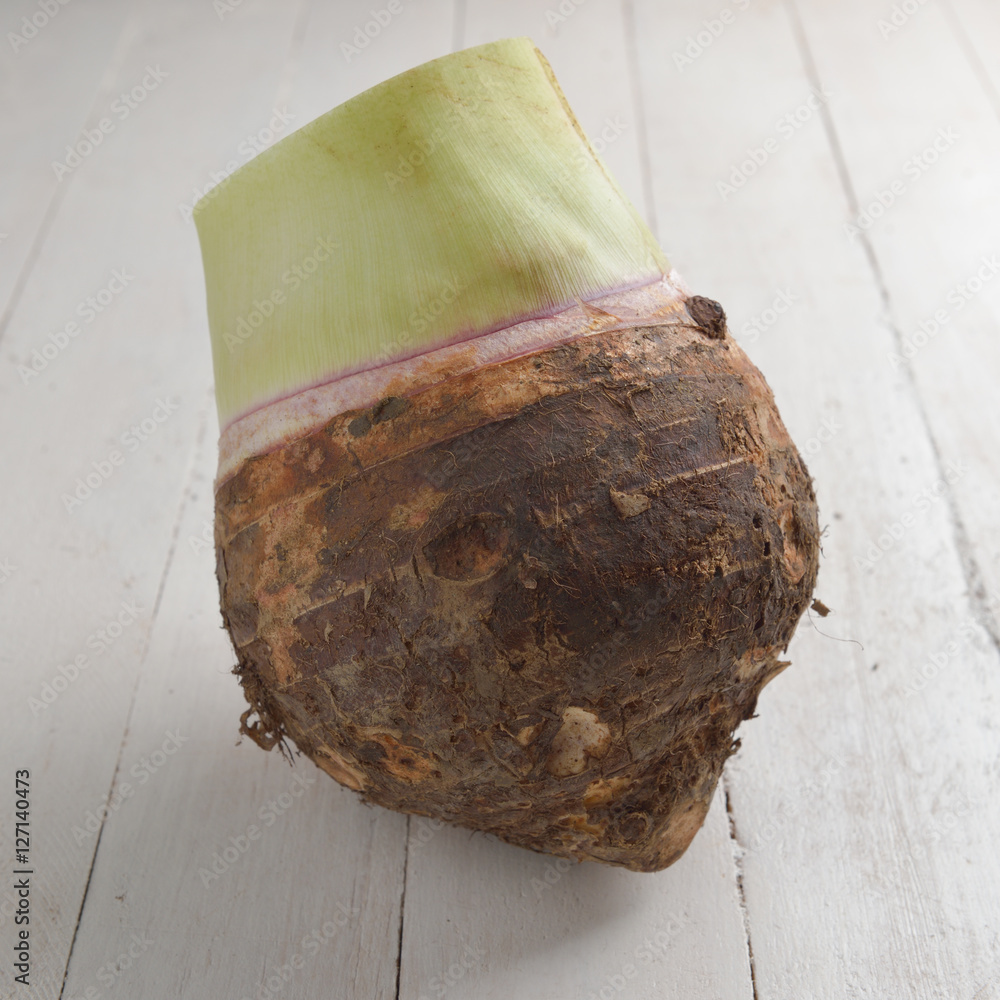 Taro on wood table background Stock Photo | Adobe Stock