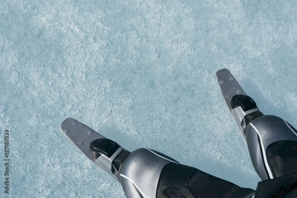 Tourists travel to Norway hiking ice skating on the frozen lake ...