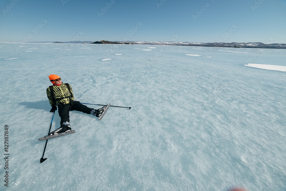 Tourists travel to Norway hiking ice skating on the frozen lake ...