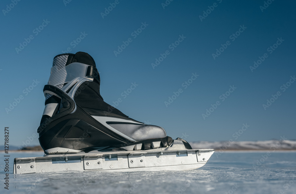 Tourists travel to Norway hiking ice skating on the frozen lake ...
