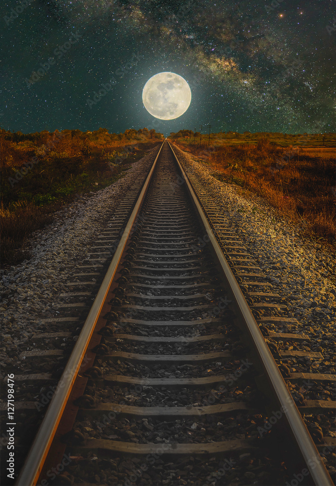 Railway Track with the moon and milky way in night sky Stock Photo ...