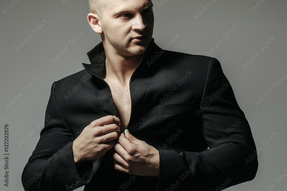 sexy muscular man in jacket Stock Photo | Adobe Stock
