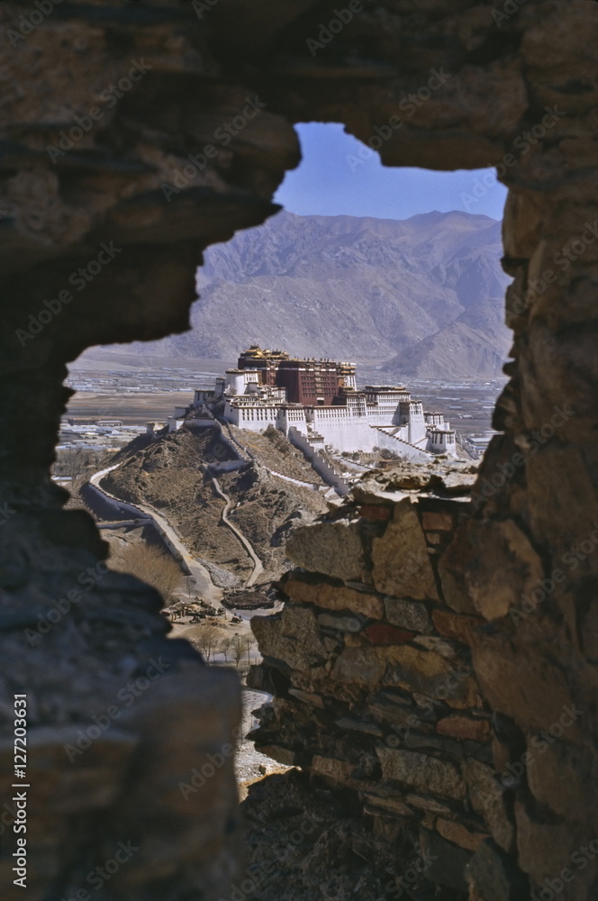 Potala Palace, seen through ruined fort window, Lhasa, Tibet, China ...