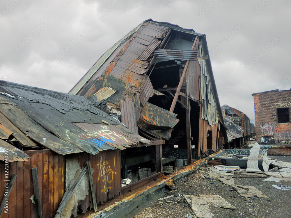 Destroyed rusty metal shanty shack crumbling in decay Stock Photo ...