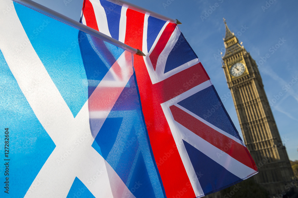 Scottish and Union Jack British flags flying in front of Westminster ...