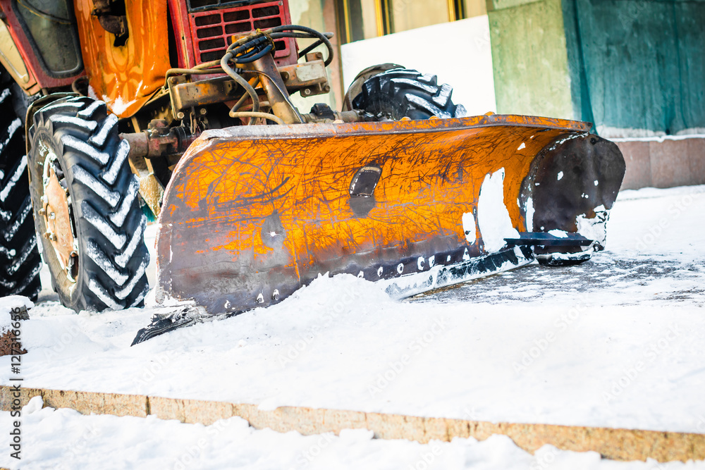 Old snow clearing machine hanging on a tractor Stock Photo | Adobe Stock
