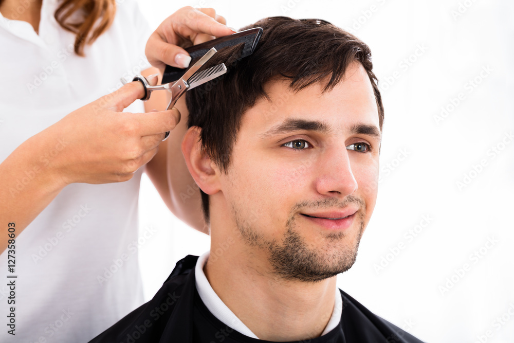Man Getting Haircut From Hairdresser Stock Photo | Adobe Stock