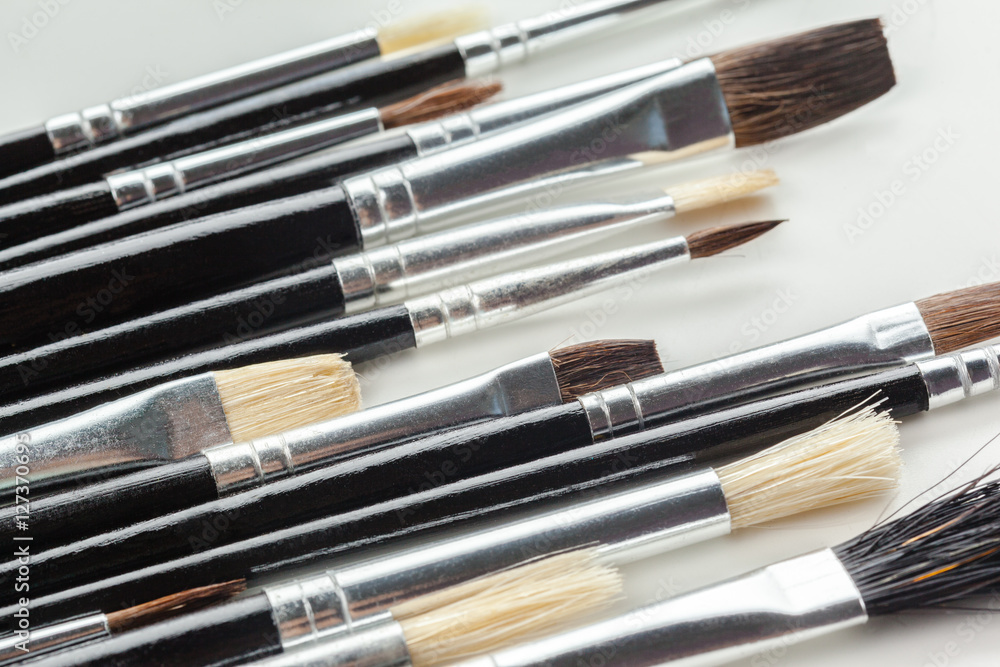 close up of paint brushes on white background Stock Photo | Adobe Stock