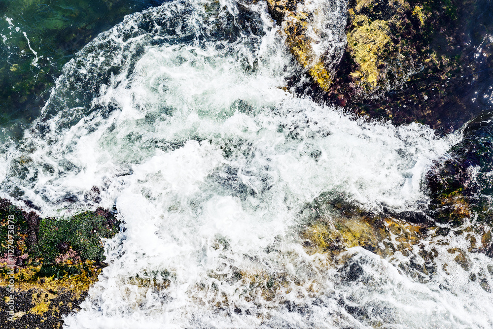 Stone rock cove cave sea ocean water foam splash wave background ...