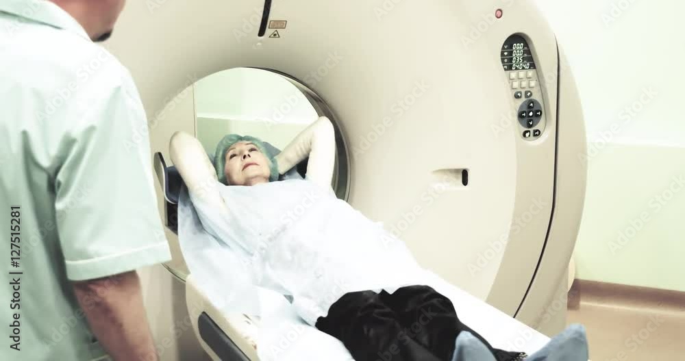 Female patient on CT MRI scanner 4k video. woman moving on computed ...
