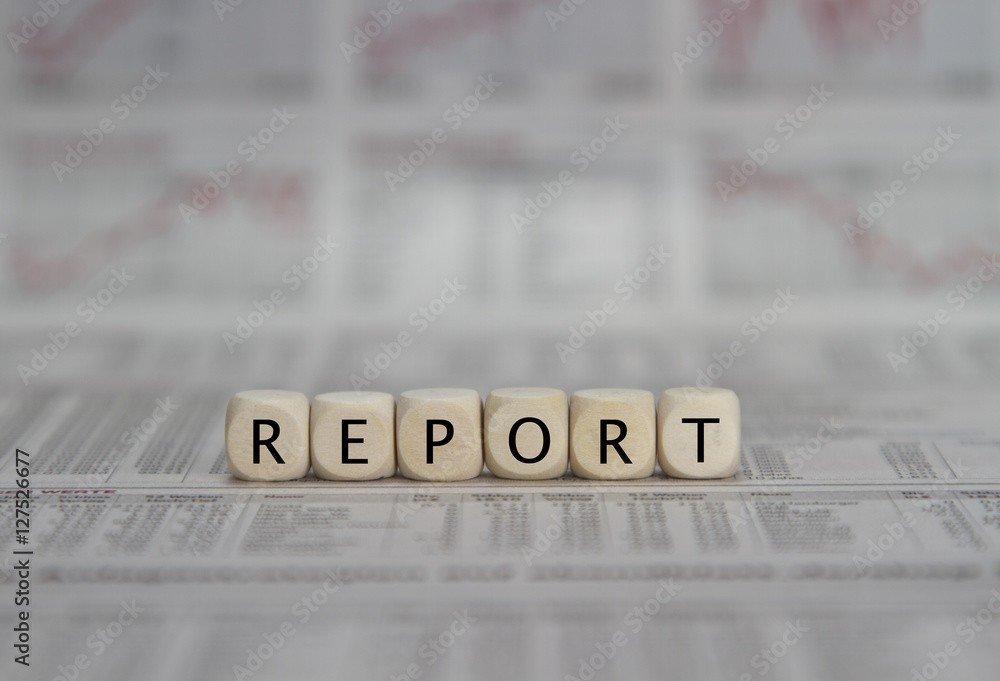 Report word built with letter cubes on newspaper background Stock Photo ...