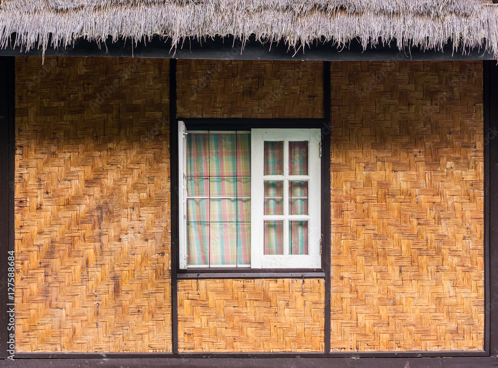 Vintage wooden window, twill weave wall and thatched roof. The ...