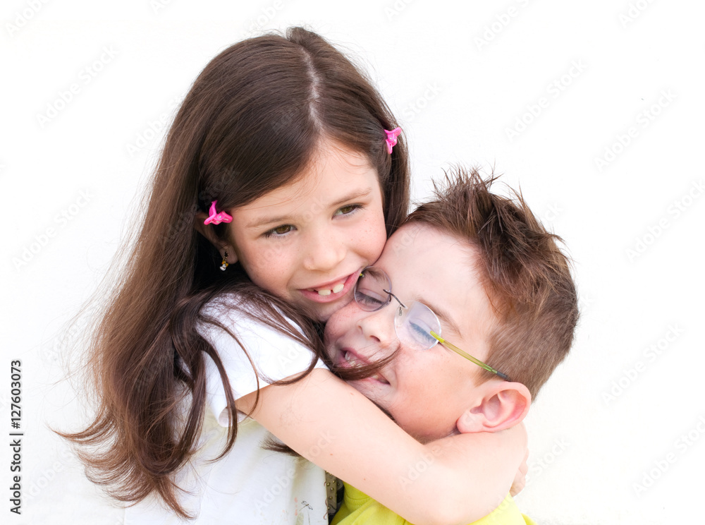 Elder sister hugging her little brother Stock Photo | Adobe Stock