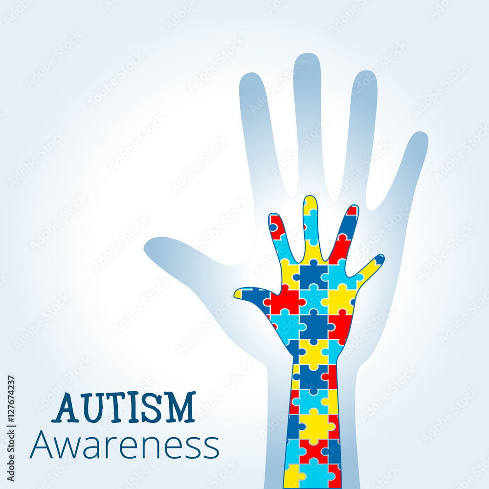Autism awareness concept with hand of puzzle pieces as symbol of autism ...