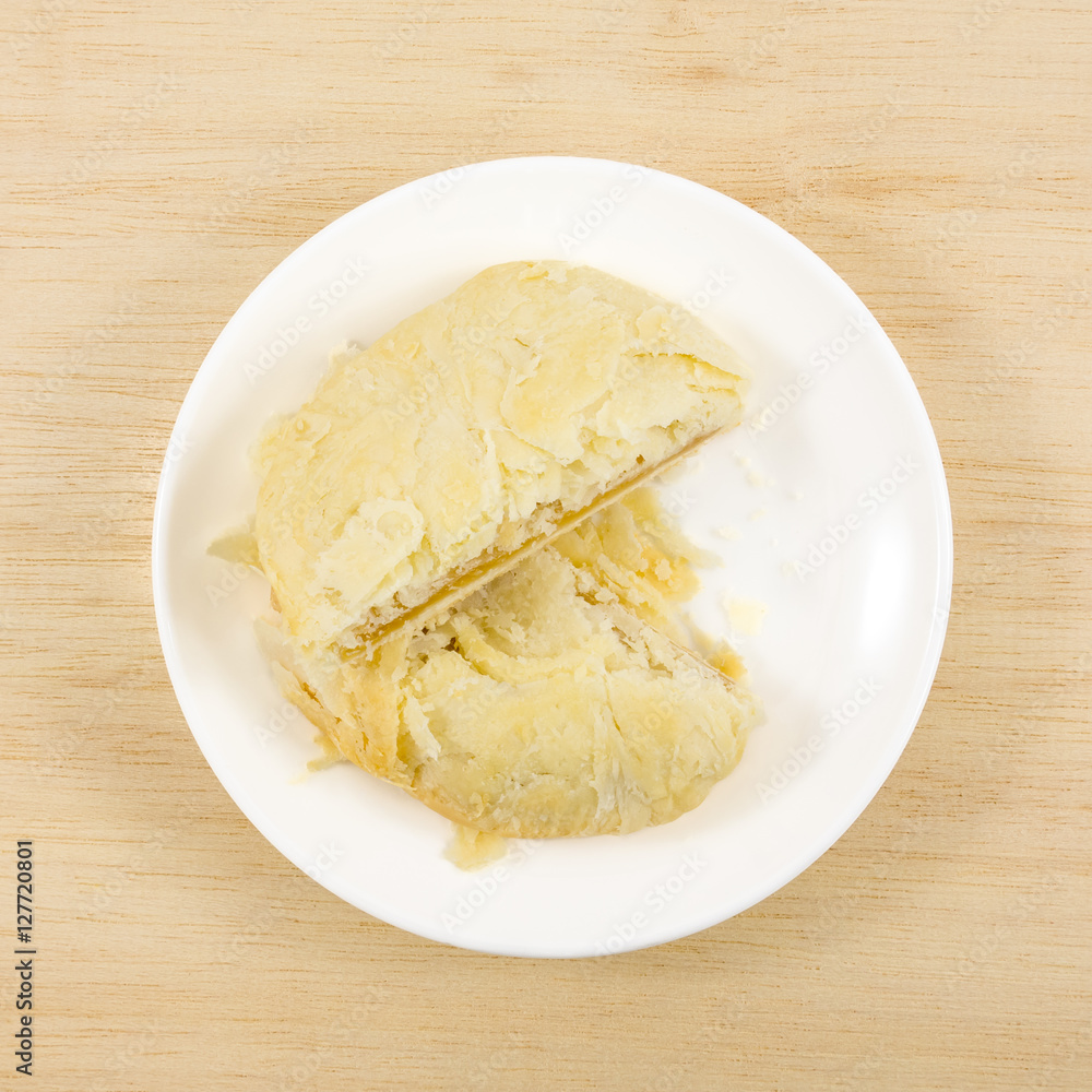 The Taiwanese sun cake (milk butter pastry) on the small white dish ...