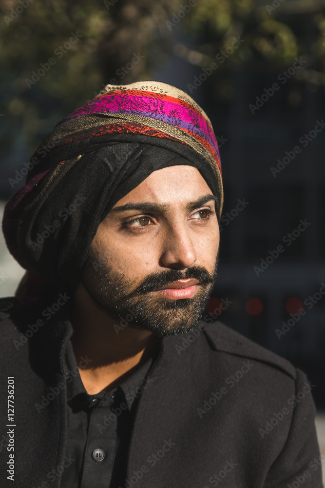 Indian man posing in an urban context. Stock Photo | Adobe Stock