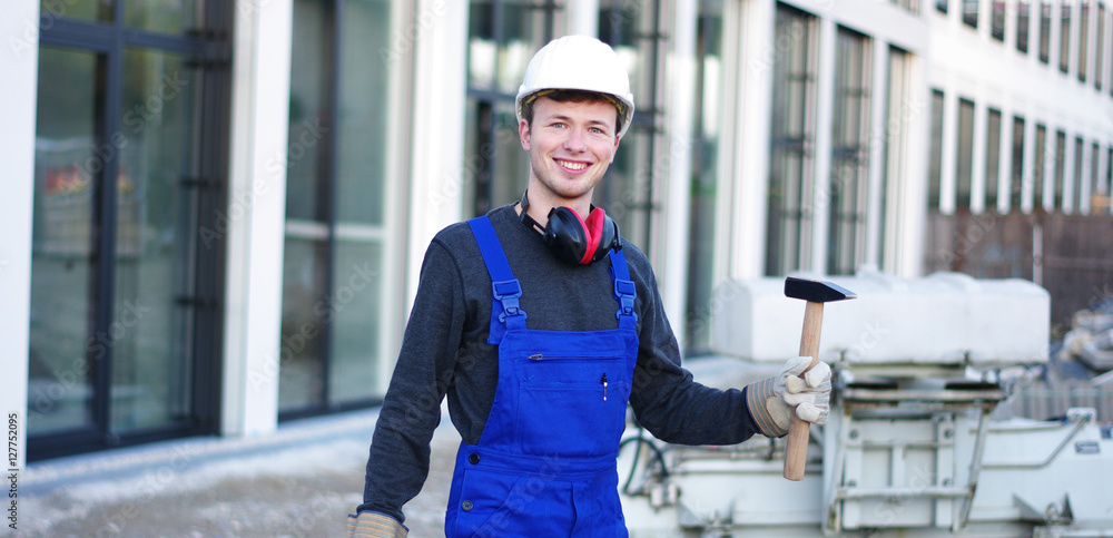Bauarbeiter bei der Arbeit auf der Baustelle Stock-Foto | Adobe Stock