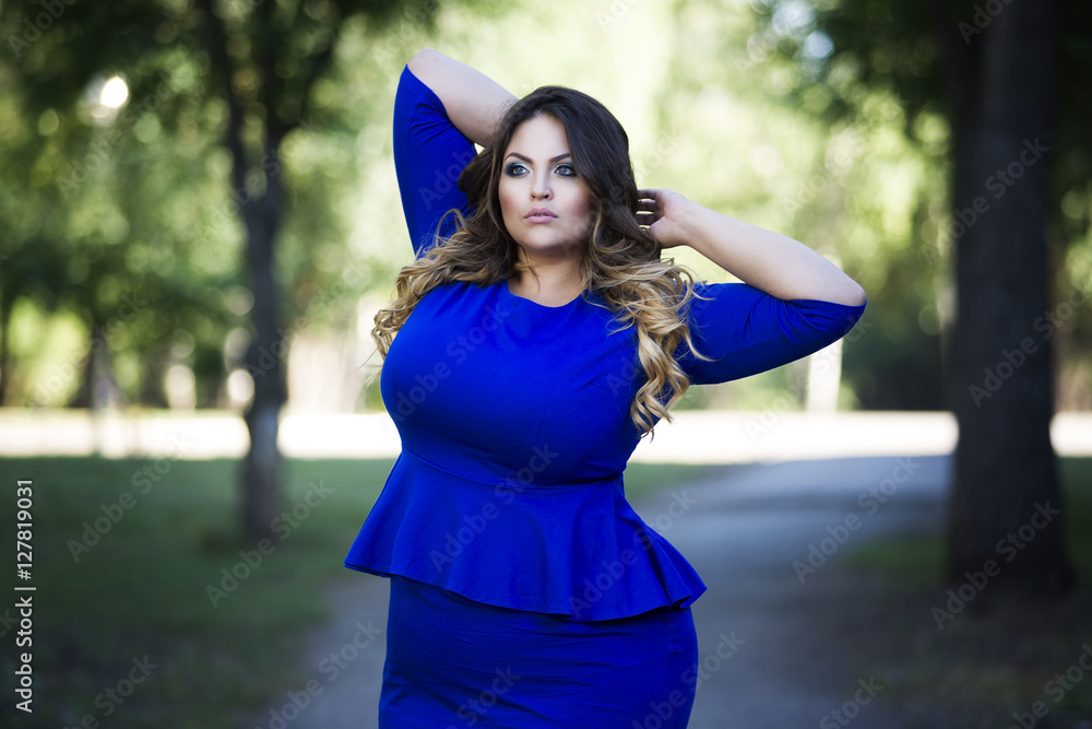 Young beautiful plus size model in blue dress outdoors, xxl woman on ...