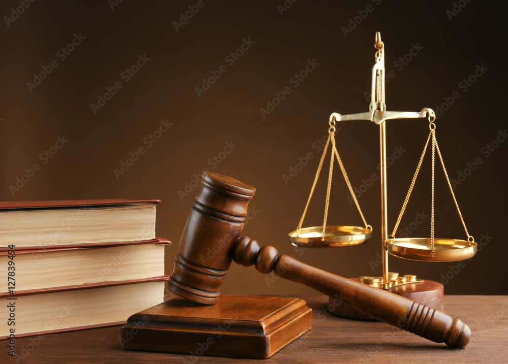 Gavel with books and scales on brown background Stock Photo | Adobe Stock
