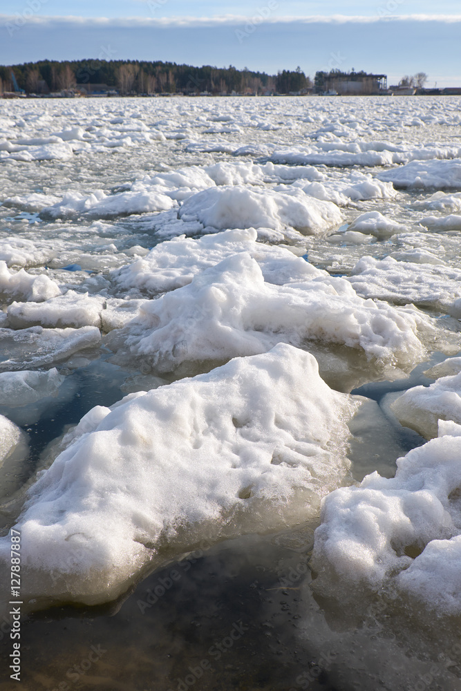 Lumps of snow and ice frazil on the surface of the freezing river Stock ...