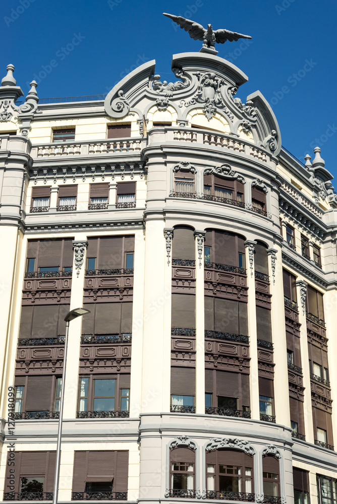 Neoclassical facade with an Eagle sculpture on the roof at the Plaza ...