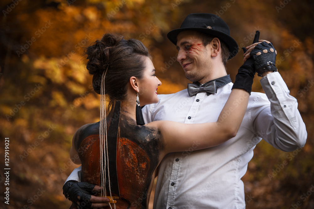Young smiling man imitating music performance on woman's back with ...