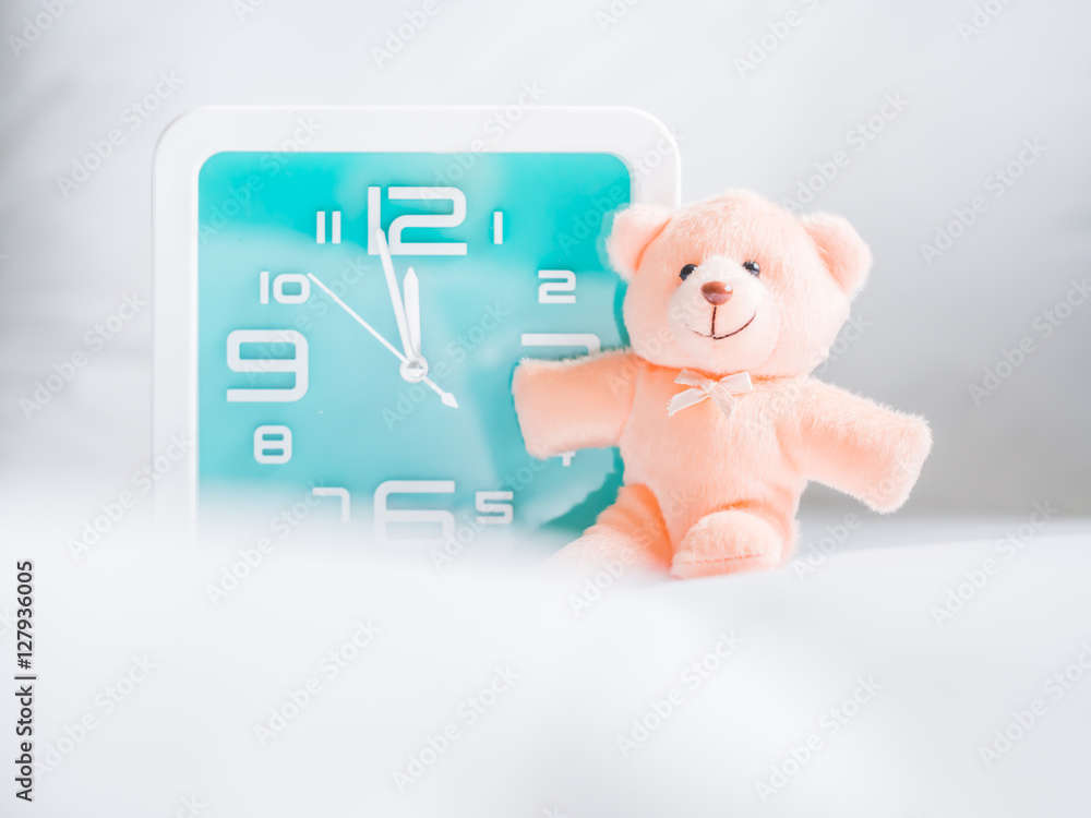 Teddy bear toy and clock on fabrics background. Concepts and ideas for ...