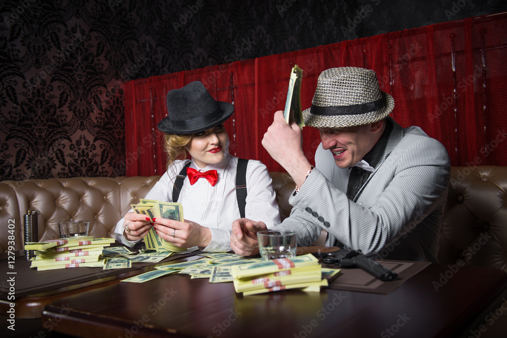 Elegant girl and man on gangster party. Mafia party in restaurant. man ...