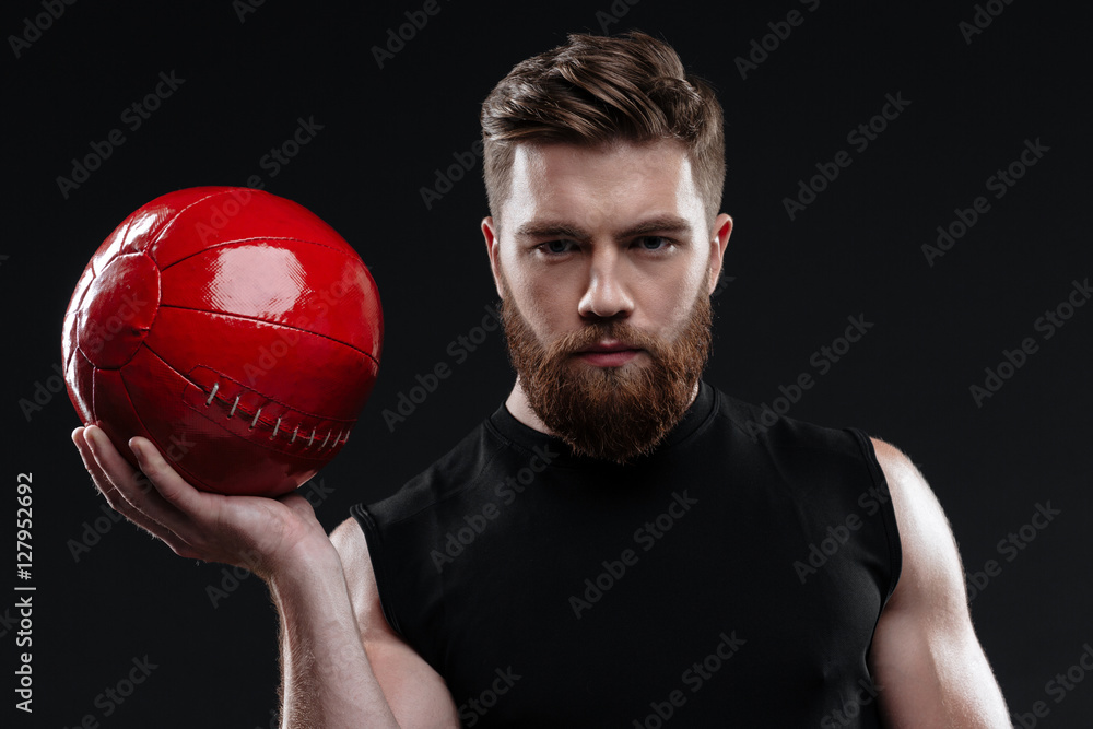 Strong man with ball Stock-Foto | Adobe Stock