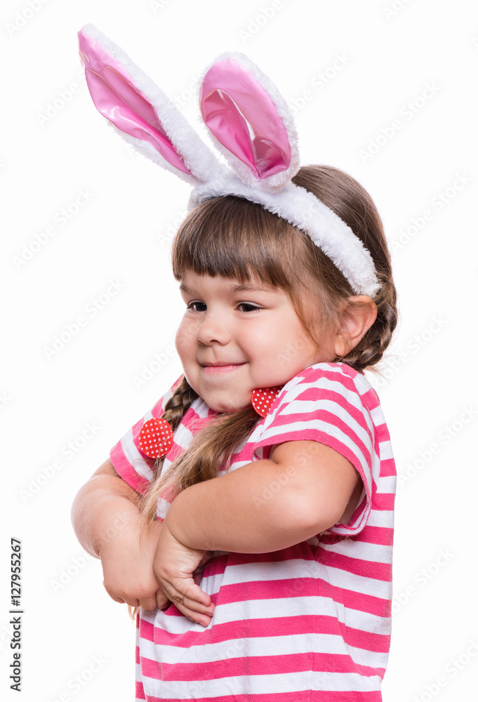 Happy little girl with pink rabbit ears. Portrait of cute caucasian ...