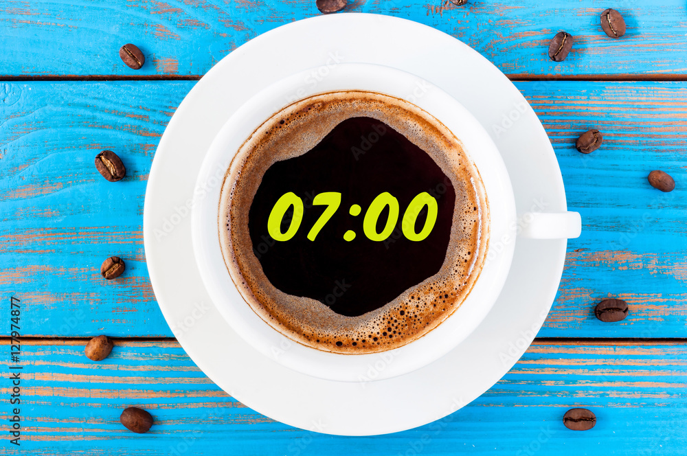 Seven hours or 7:00 on morning cup of coffee like a round clock face ...