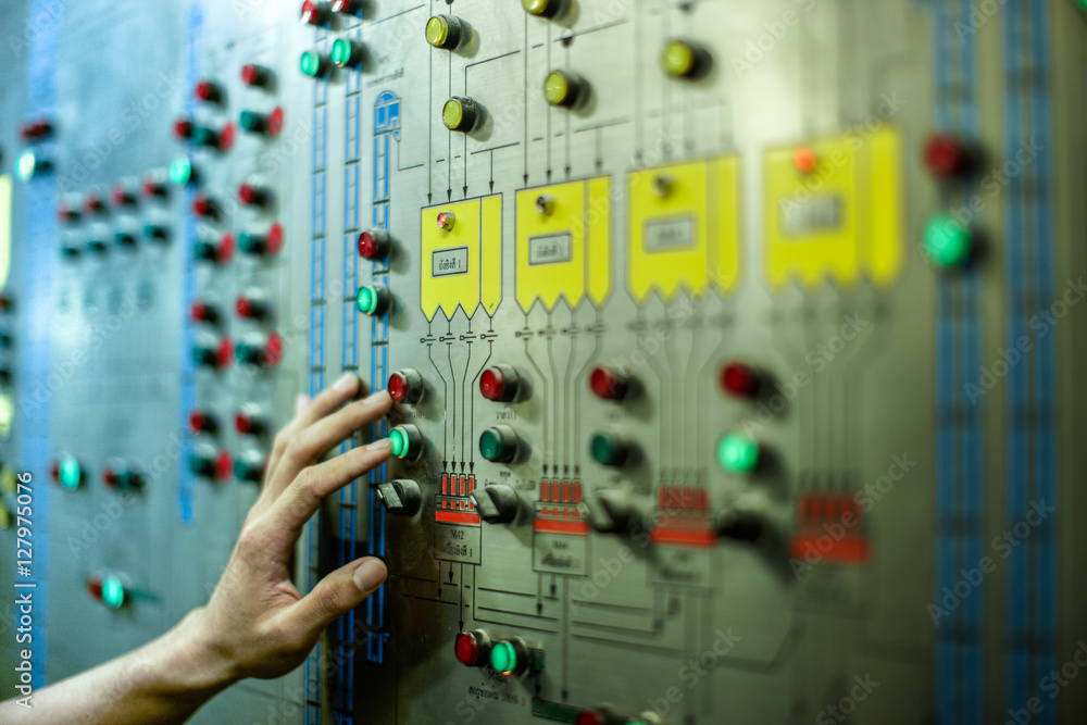 Hand touch button on control panel board Stock Photo | Adobe Stock