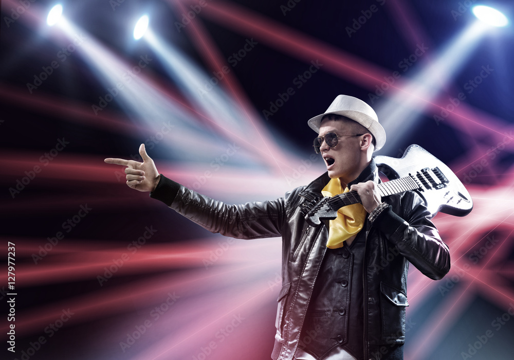 Rock star on stage Stock Photo | Adobe Stock