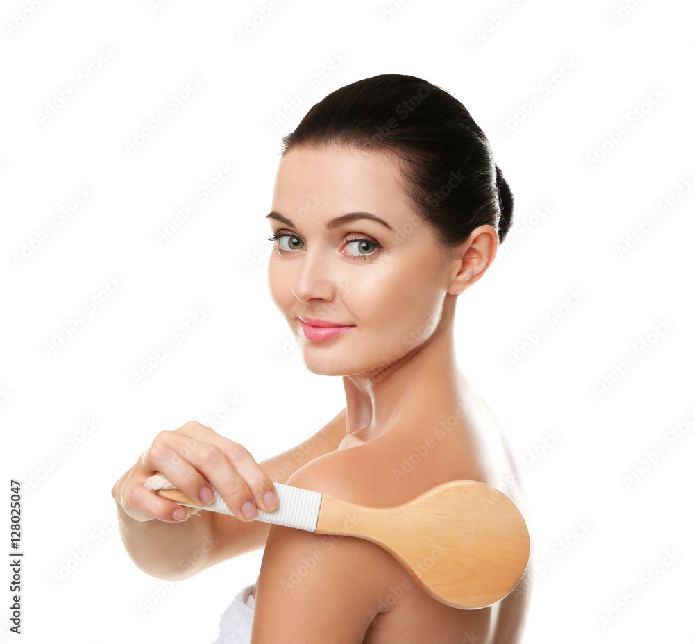 Beautiful young woman using brush on white background Stock Photo ...