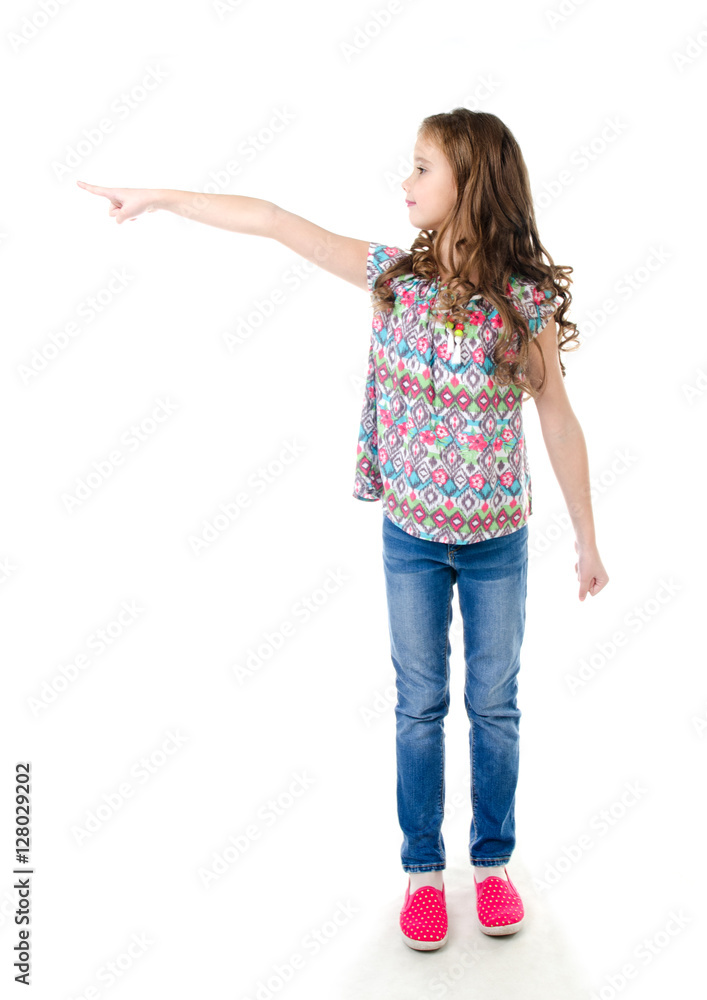 Cute little girl is pointing to the side isolated Stock Photo | Adobe Stock